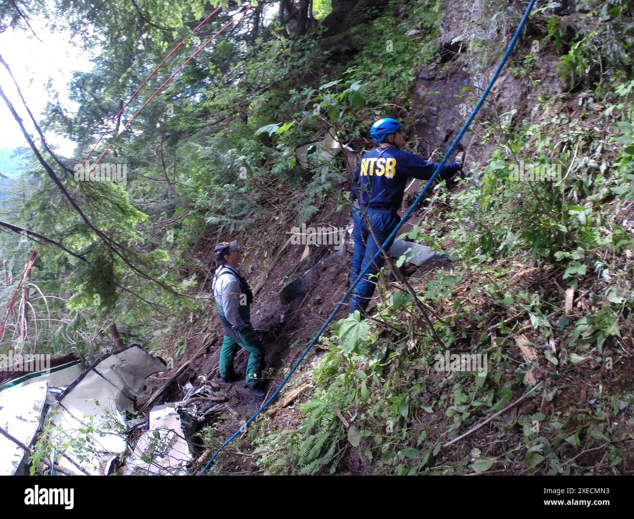 NTSB investigator Clint Crookshanks and a member of the Ketchikan ...