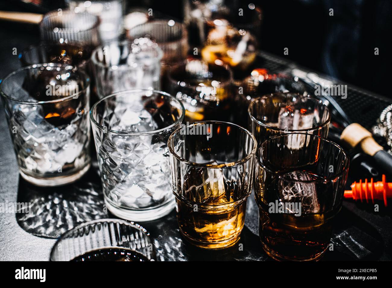 Whiskey Cocktail with Ice Sphere in a Moody Bar Setting Stock Photo - Alamy