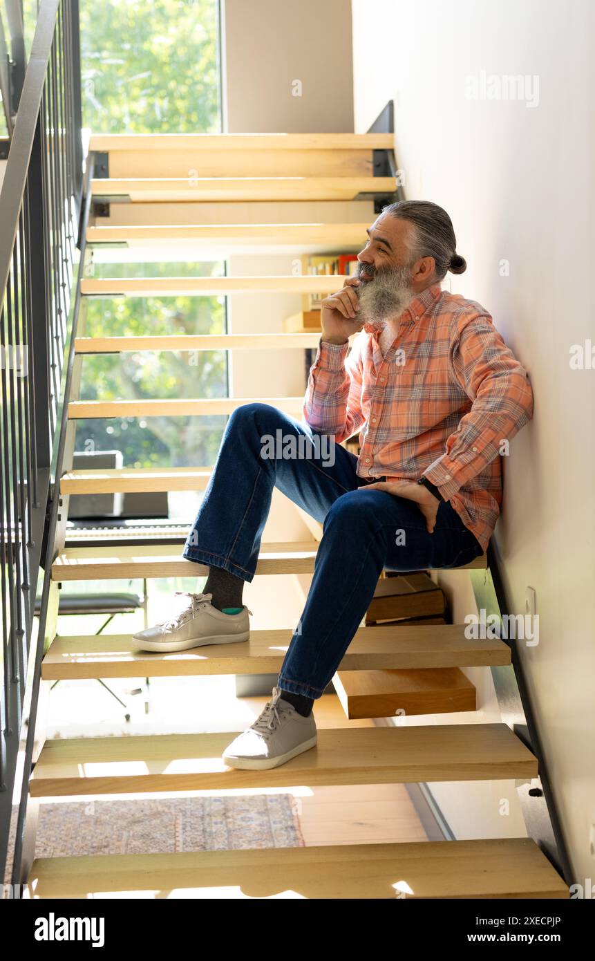 Man sitting alone on stairs hi-res stock photography and images - Alamy