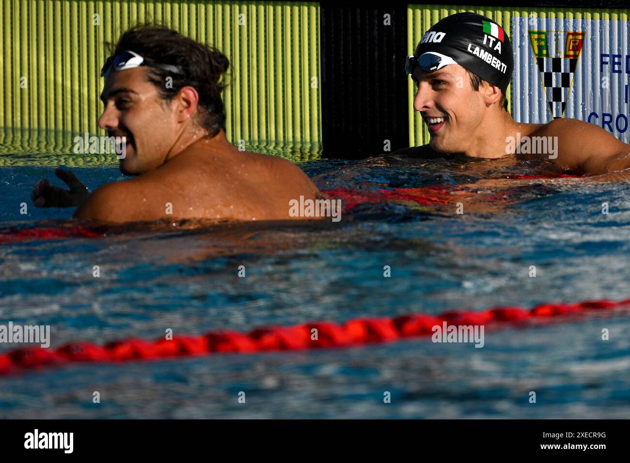 Thomas Ceccon and Michele Lamberti of Italy reacts after competing in ...