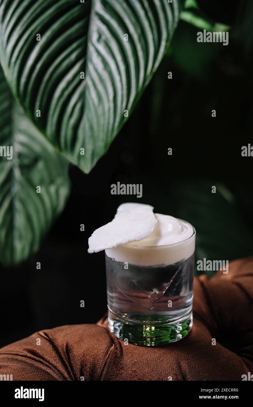 Glass filled with coconut water and foam Stock Photo - Alamy