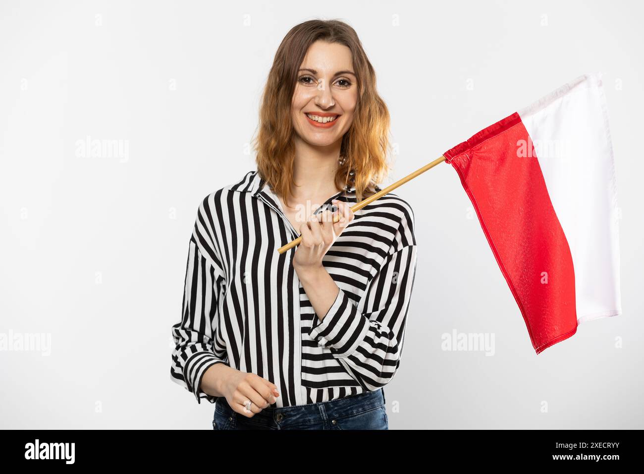 Young girl with a flag of Poland. The student holds the national flag ...