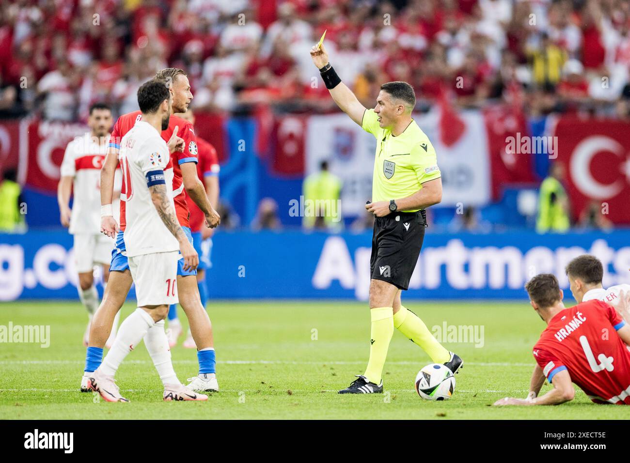 Hamburg, Germany. 26th June, 2024. Referee Istvan Kovacs books Antonin ...