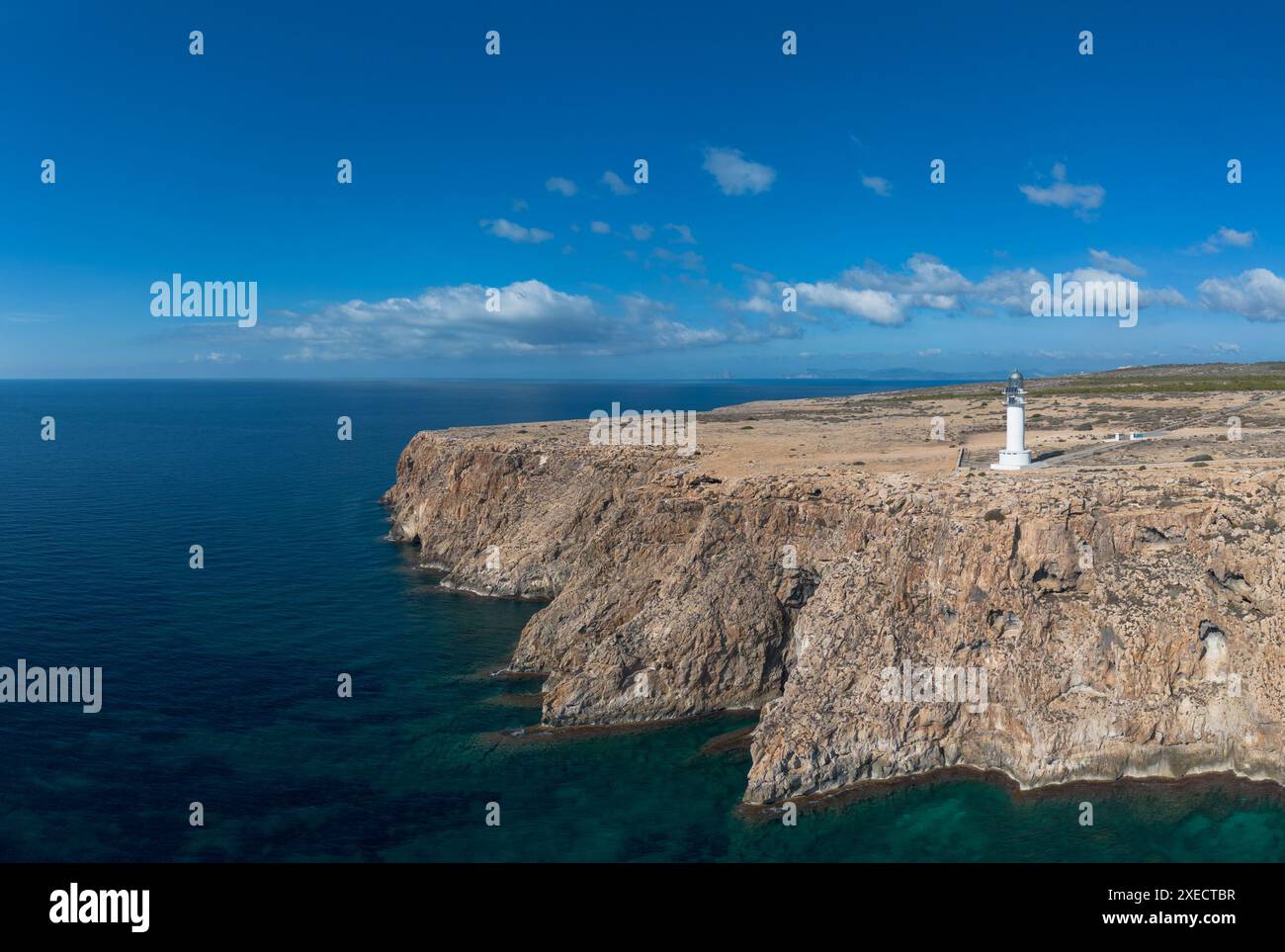 Aerial view of Cap de Barbaria and the landmark lighthouse on ...