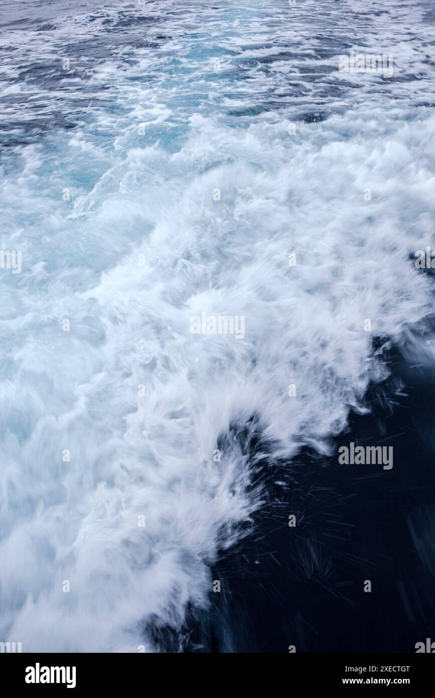 Sea water churned up into foam by the engine of a small boat Stock ...