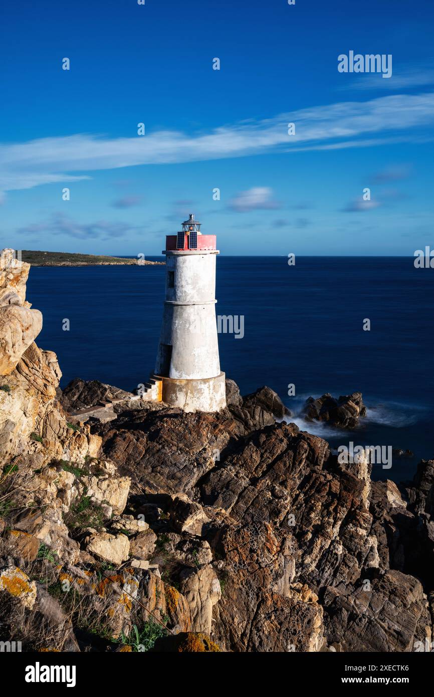 Vertical view of the old Capo Ferro Lighthouse in Sardinia Stock Photo ...