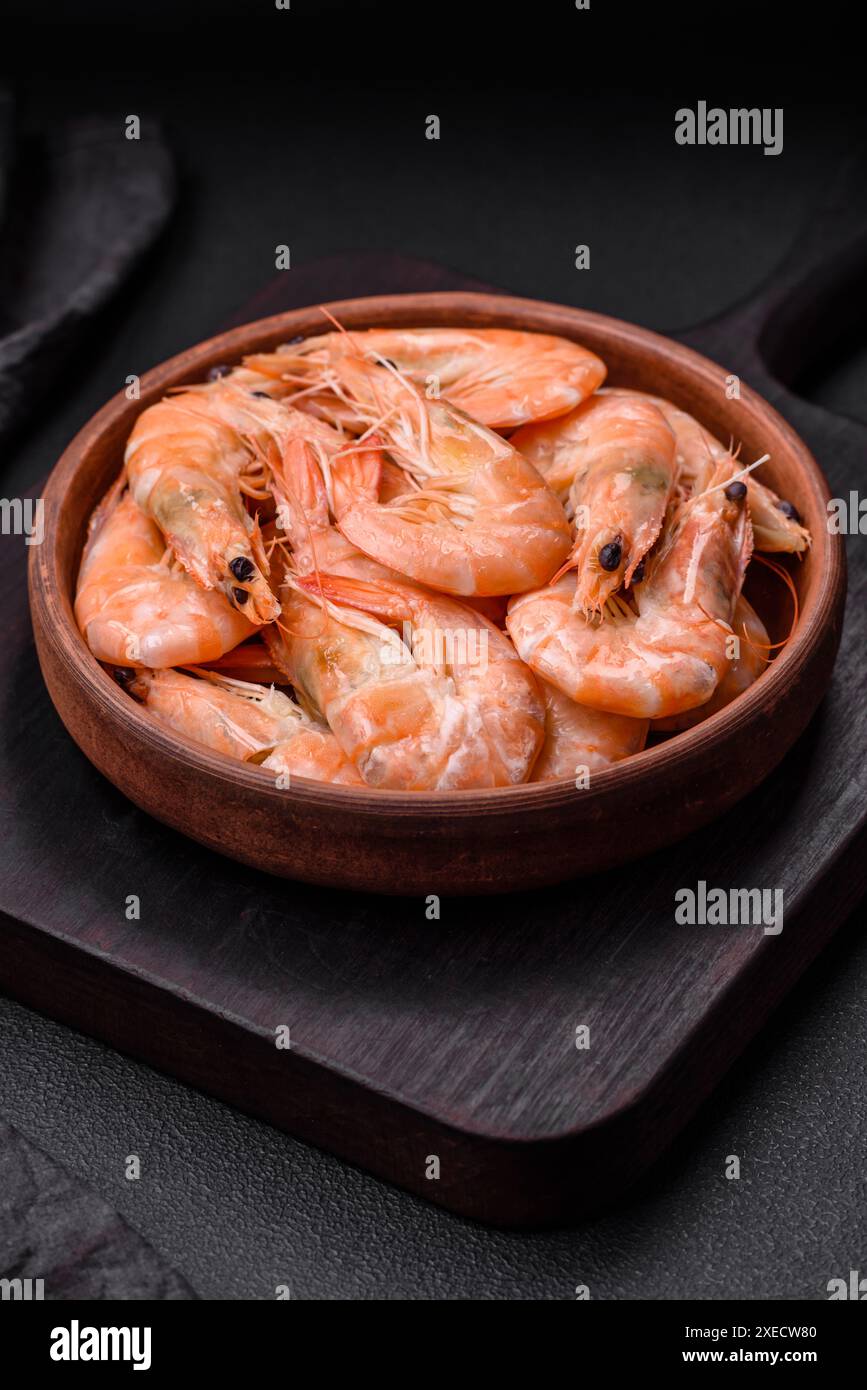 Delicious fresh boiled tiger prawns with salt and spices on a ceramic ...