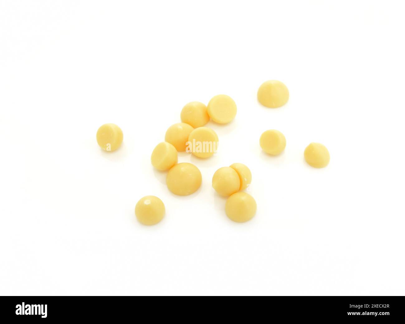 Organic cocoa butter buttons (wafers) isolated on white background ...