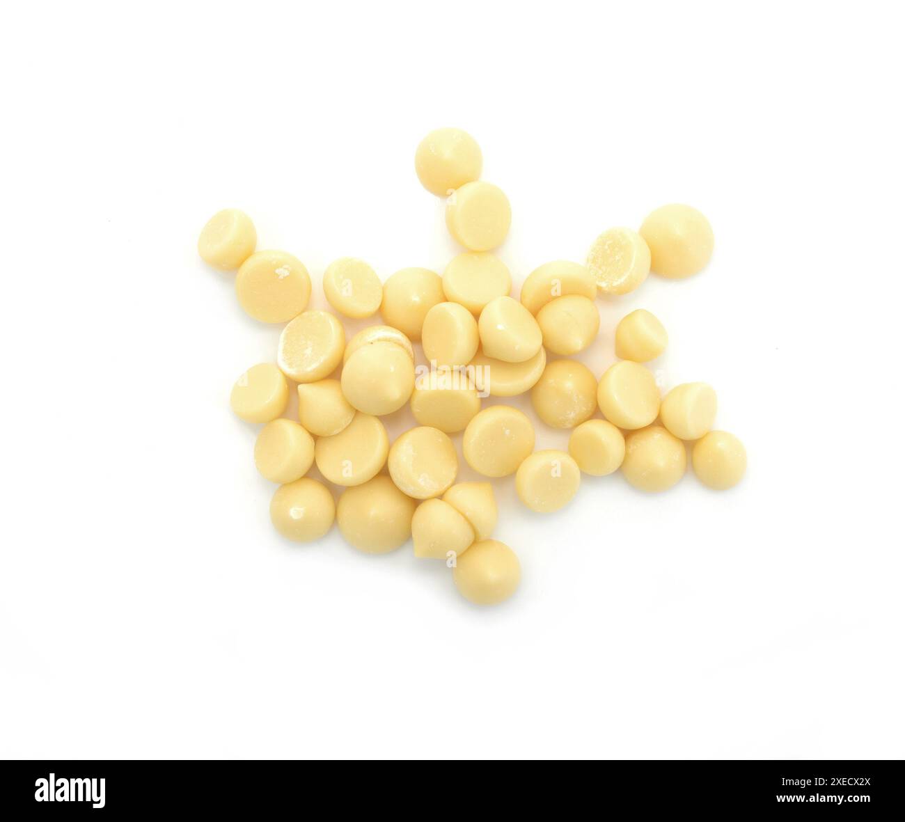 Organic cocoa butter buttons (wafers) isolated on white background ...