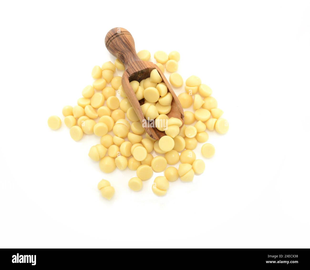 Organic cocoa butter buttons (wafers) isolated on white background ...