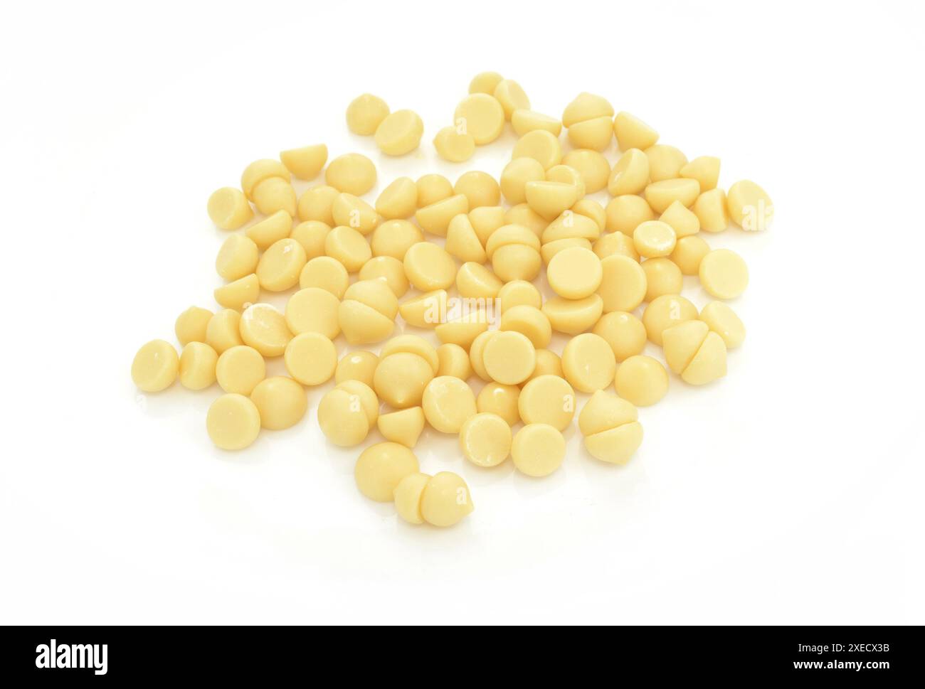Organic cocoa butter buttons (wafers) isolated on white background ...