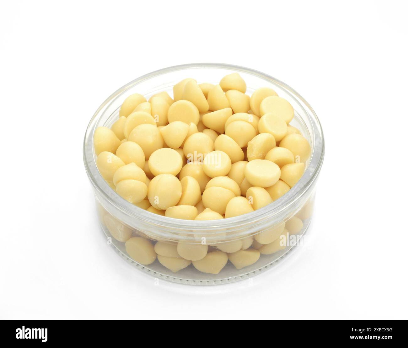 Organic cocoa butter buttons (wafers) isolated on white background ...