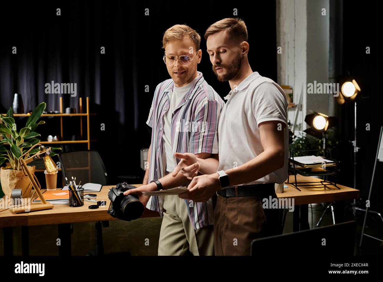 Two men in casual clothes working together Stock Photo - Alamy