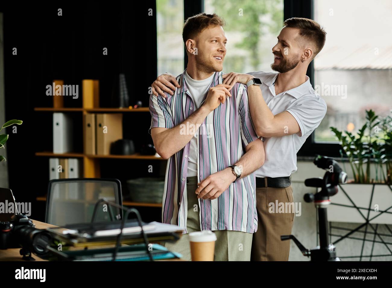 Two content men in casual attire standing side by side Stock Photo - Alamy