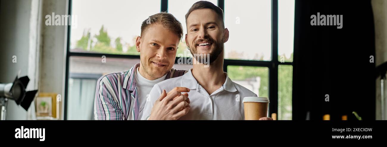 Two men in casual attire stand side by side, exuding happiness and ...