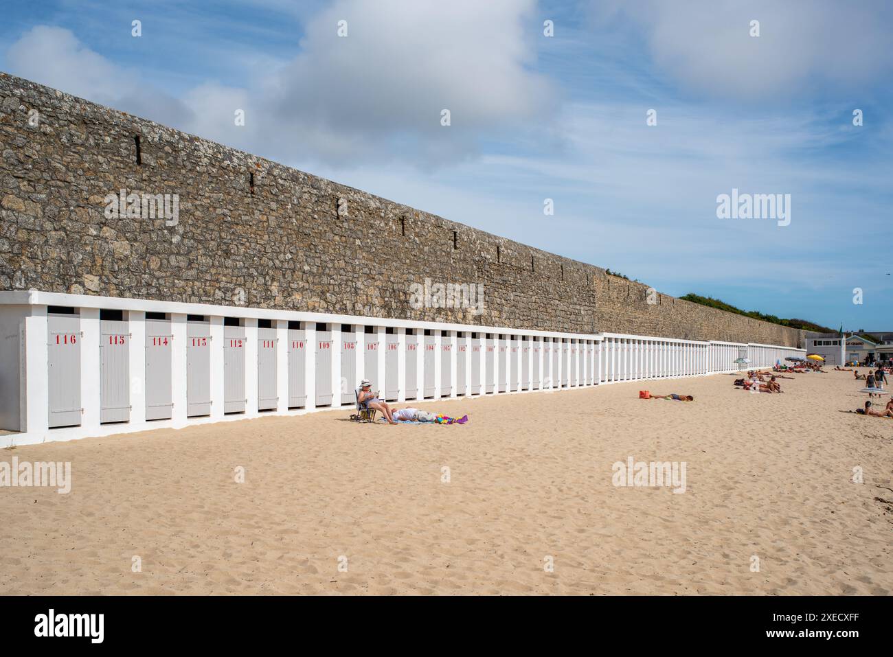 View of the sunny beachfront alongside the historic wall of Port Louis ...