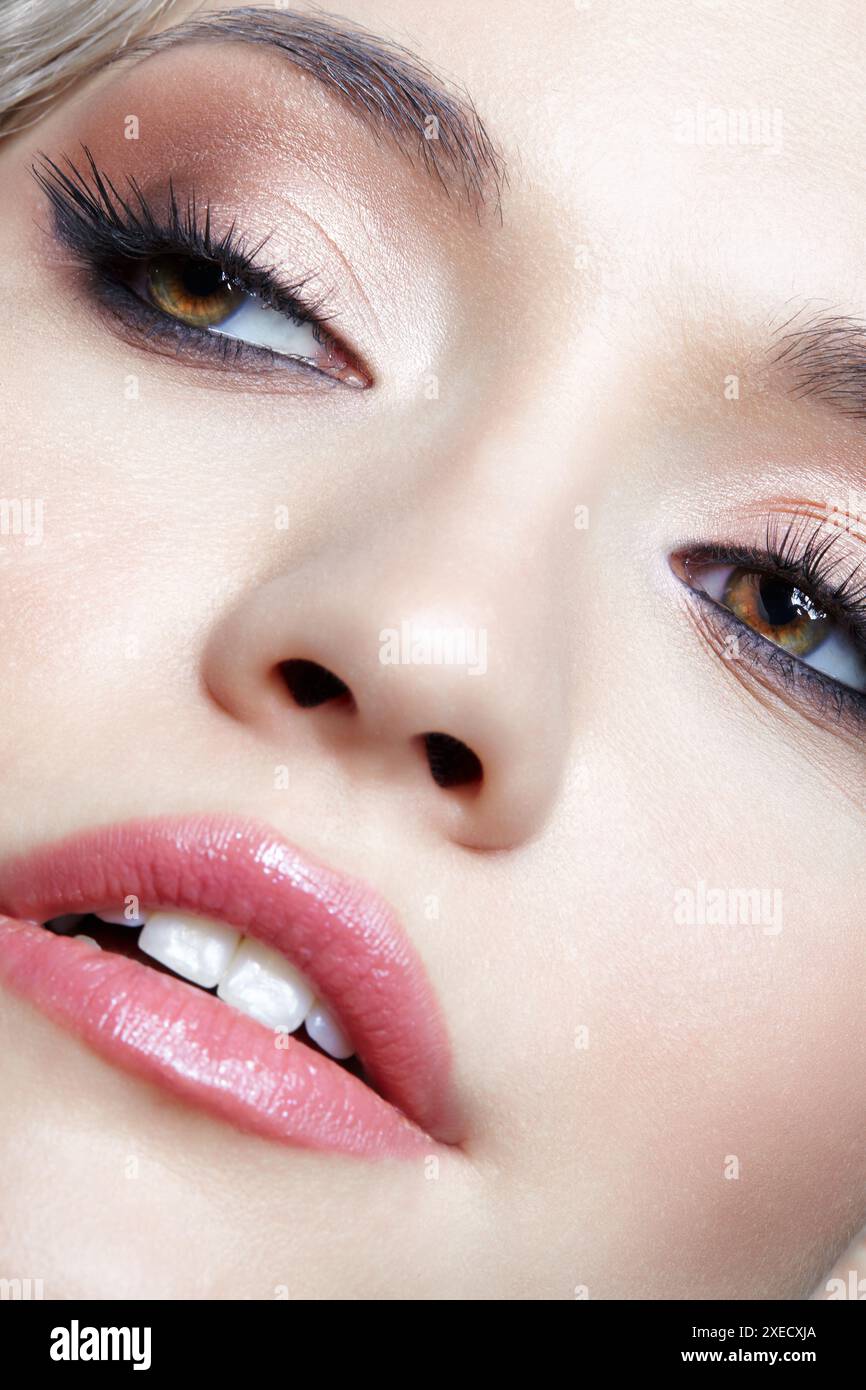 Closeup macro shot of human female face. Woman with eyes and lips ...