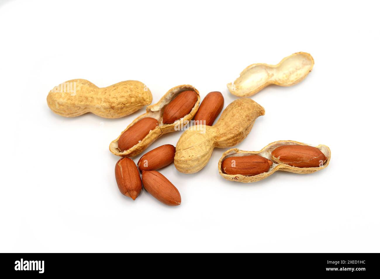 Raw peanuts top view isolated on white background (shelled, husk, whole ...