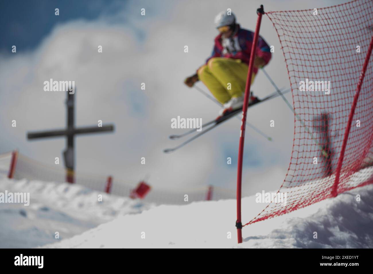 Making a jump while skiing Stock Photo - Alamy