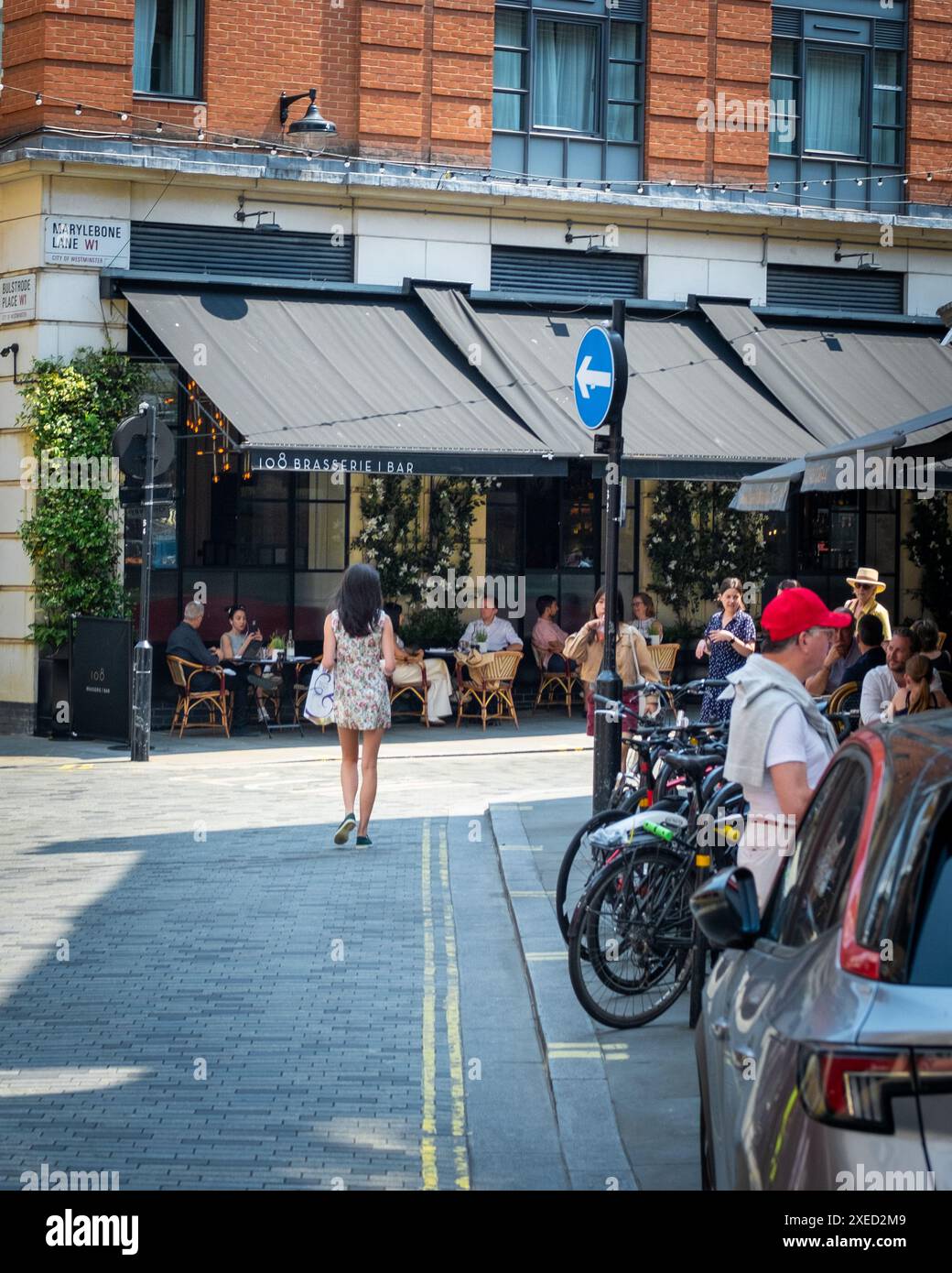 LONDON- JUNE 26, 2024: Marylebone shopping street scene. Upmarket area ...
