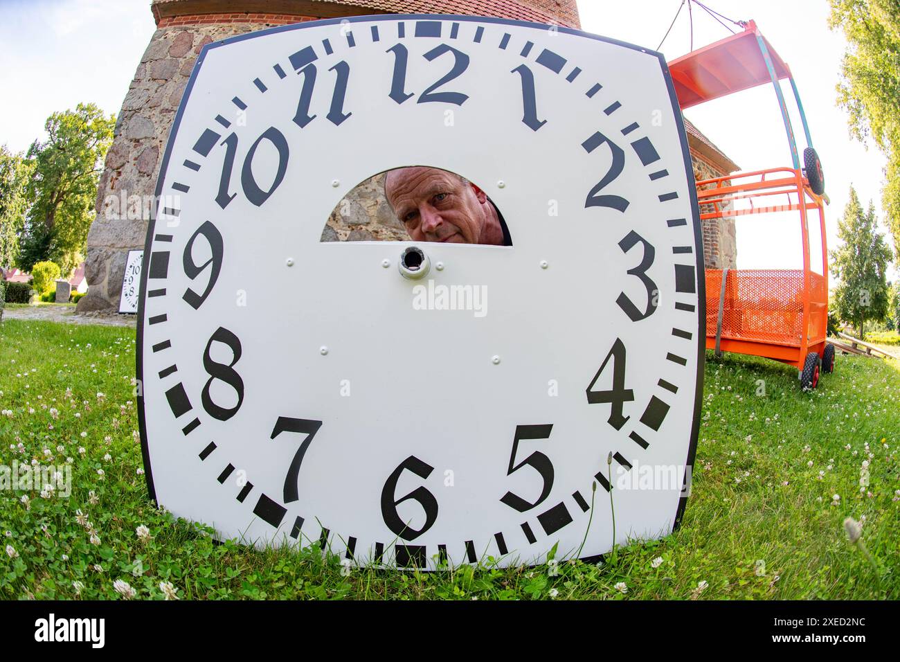 Reinkenhagen, Germany. 27th June, 2024. Udo Griwahn, clock technician ...