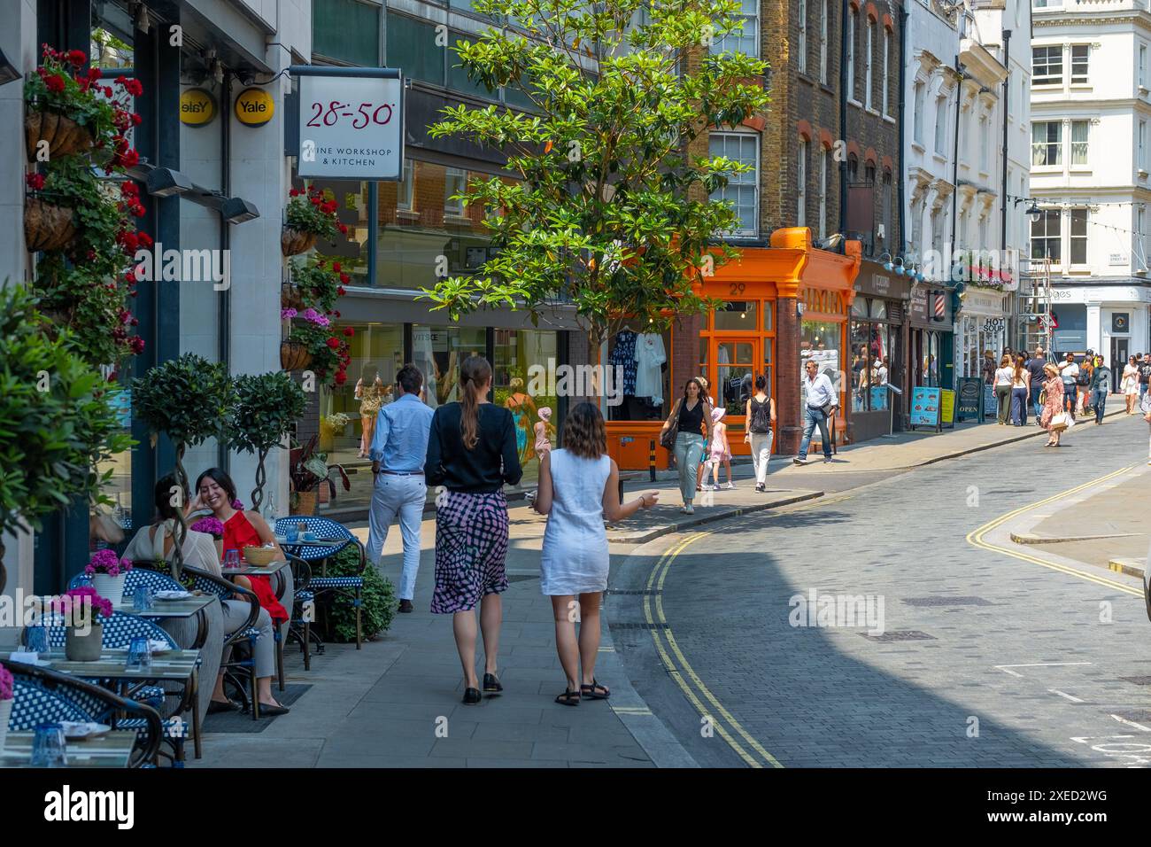 LONDON- JUNE 26, 2024: Marylebone shopping street scene. Upmarket area ...