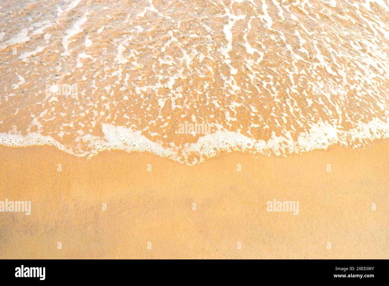 Beach sand and sea wave Stock Photo - Alamy