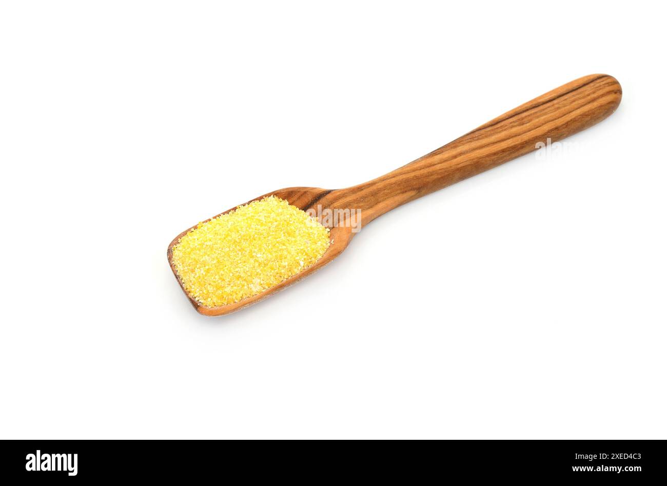 Uncooked cornmeal maize flour heap in a spoon isolated on white ...