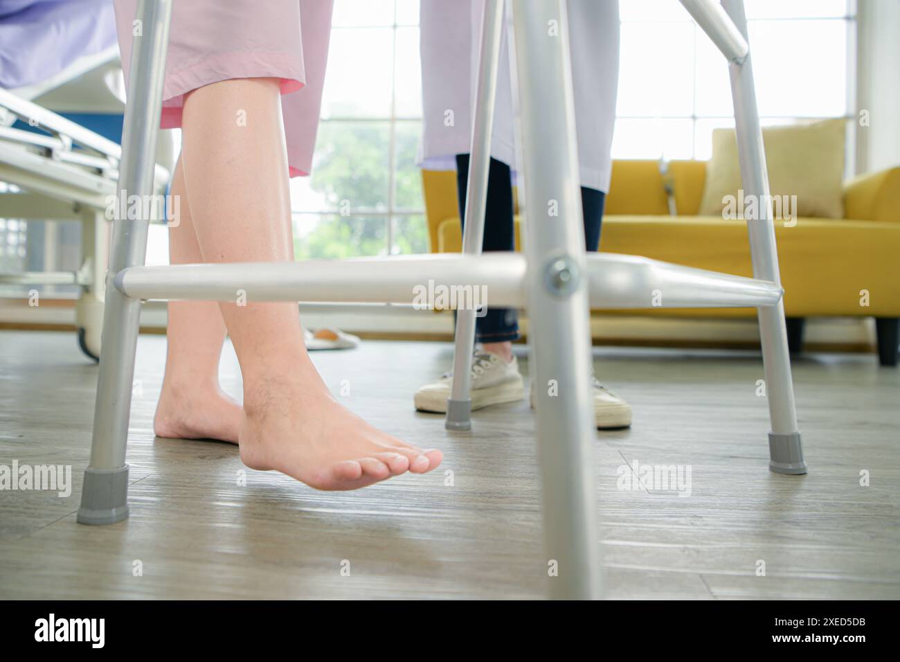 Following a period of treatment, the doctor examines the patient's legs ...