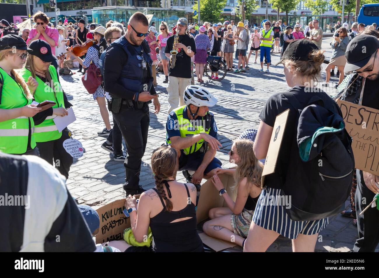 Police negotiator cautioning participants in the ‘Storm warning ...