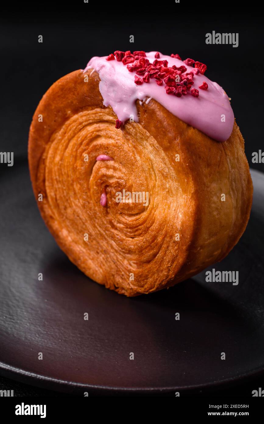 Round puff pastry croissant with raspberry filling or new york roll ...