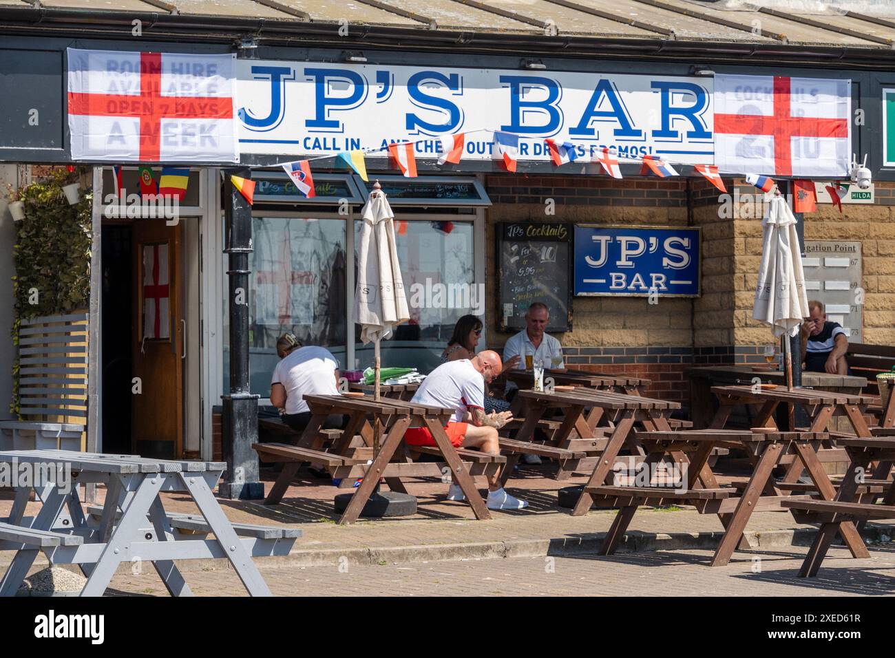 Hartlepool, Cleveland, UK. England and other flags outside of JP's Bar ...