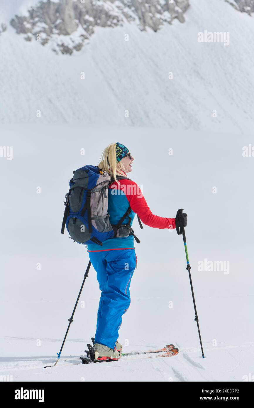A Female Mountaineer Ascends the Alps with Backcountry Gear Stock Photo ...