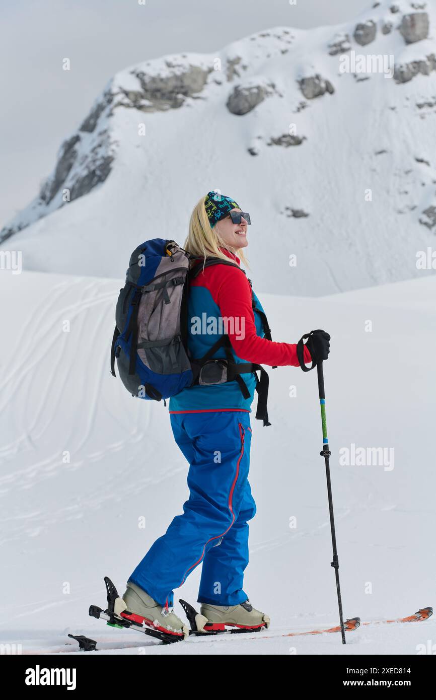 A Female Mountaineer Ascends the Alps with Backcountry Gear Stock Photo ...