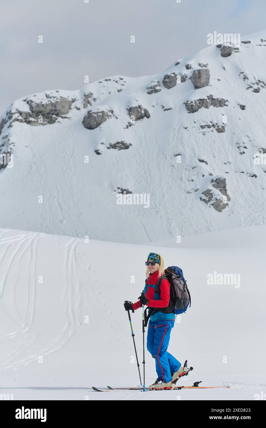 A Female Mountaineer Ascends the Alps with Backcountry Gear Stock Photo ...