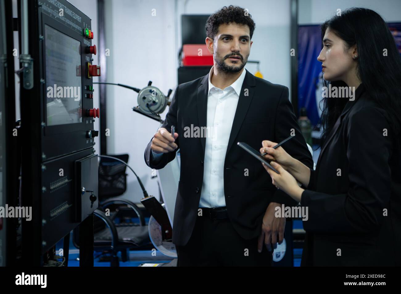 Businessperson of factory industry inspection and testing of robots arm ...
