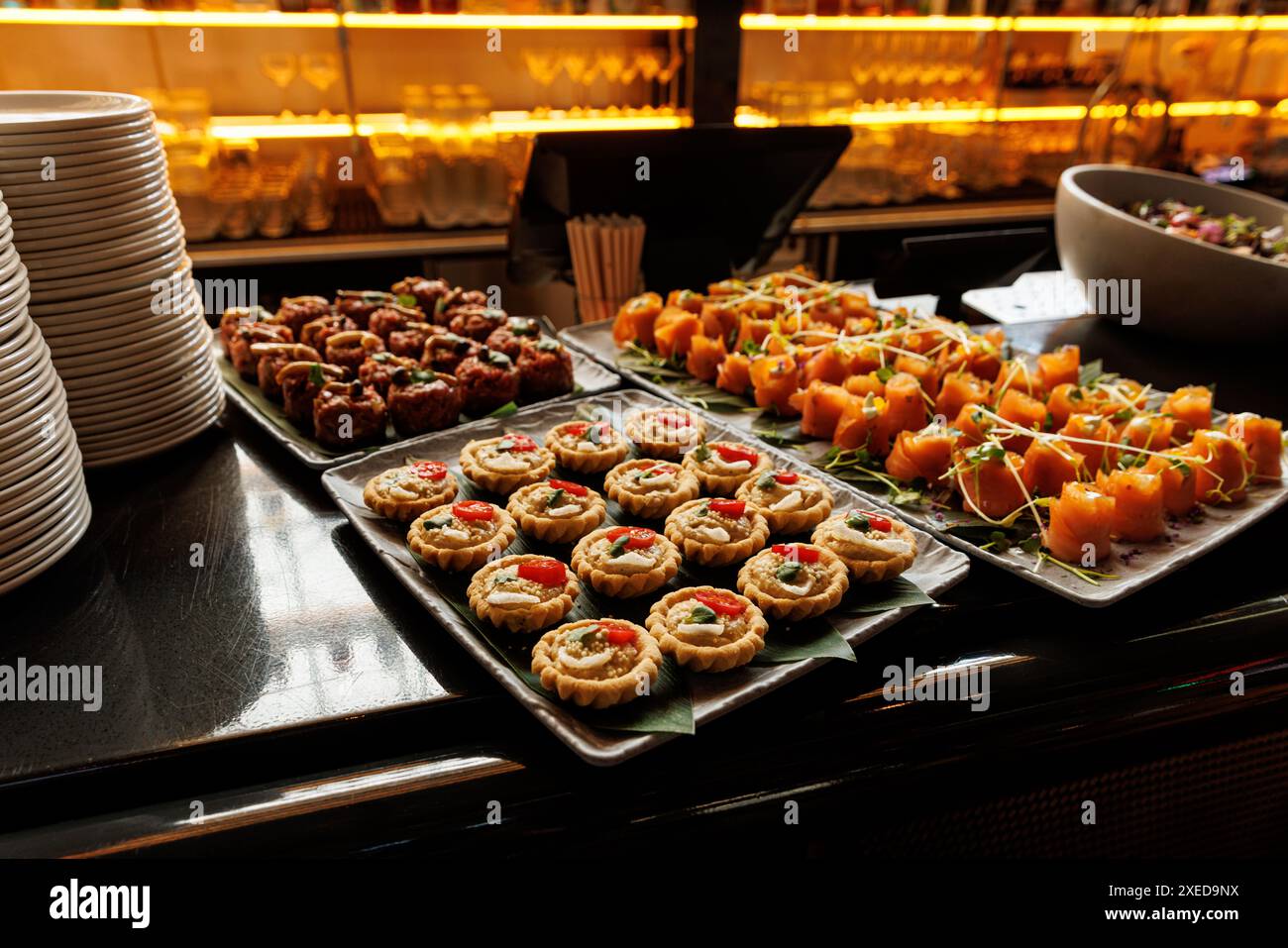 An array of gourmet appetizers, elegantly presented on trays Stock Photo - Alamy