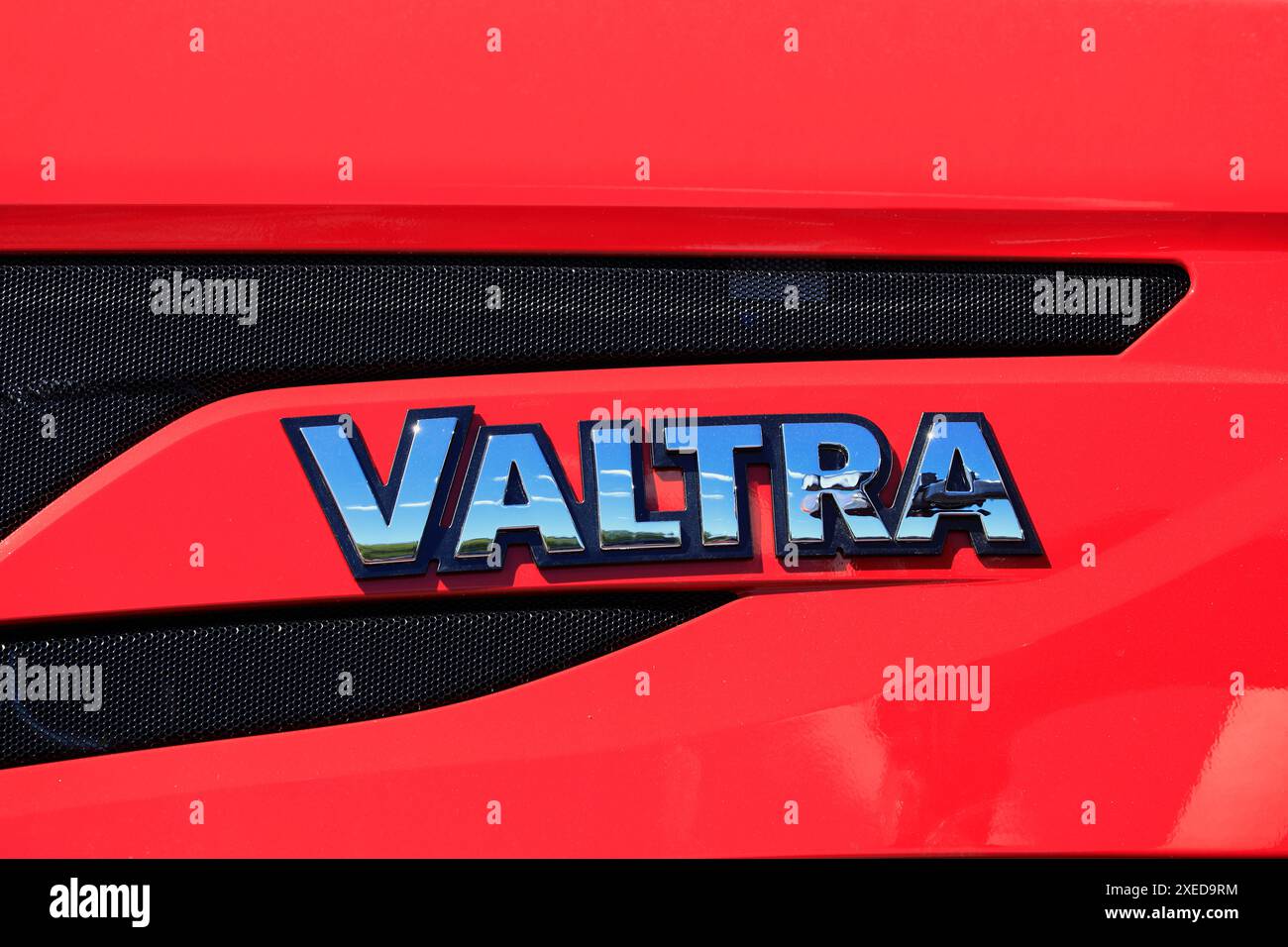 Valtra logo on the side of a red, modern Valtra farm tractor. Salo ...