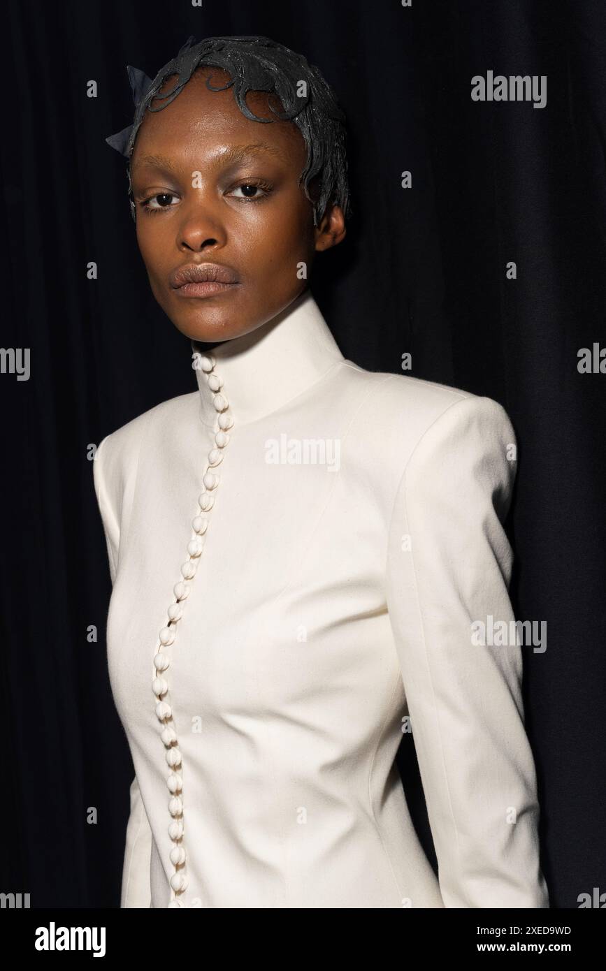 Models prepare backstage at the Thom Browne Haute Couture Fall-Winter ...