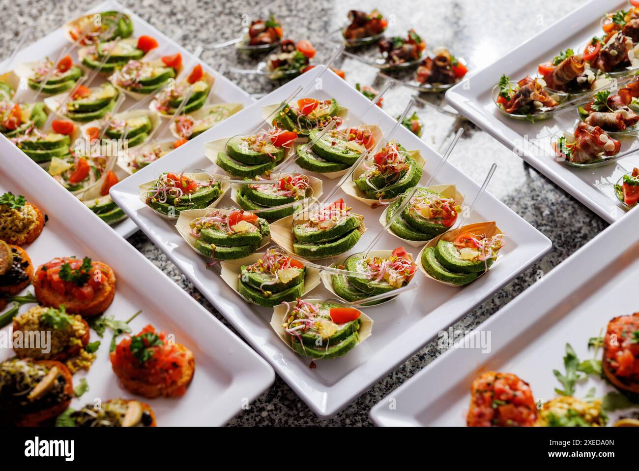 A culinary presentation featuring elegant hors d oeuvres on raised ...