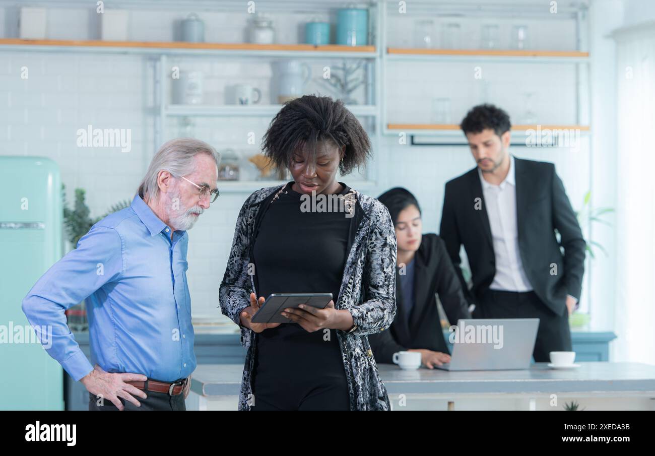Portrait of group of small business owners, using their home as a ...