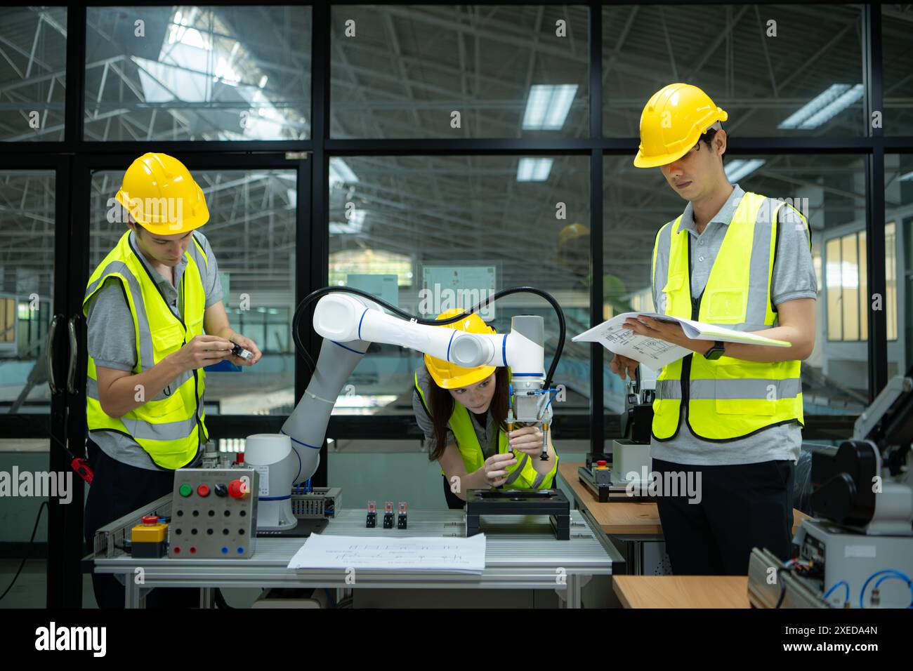 Group of engineers and technicians learning the technology to control ...