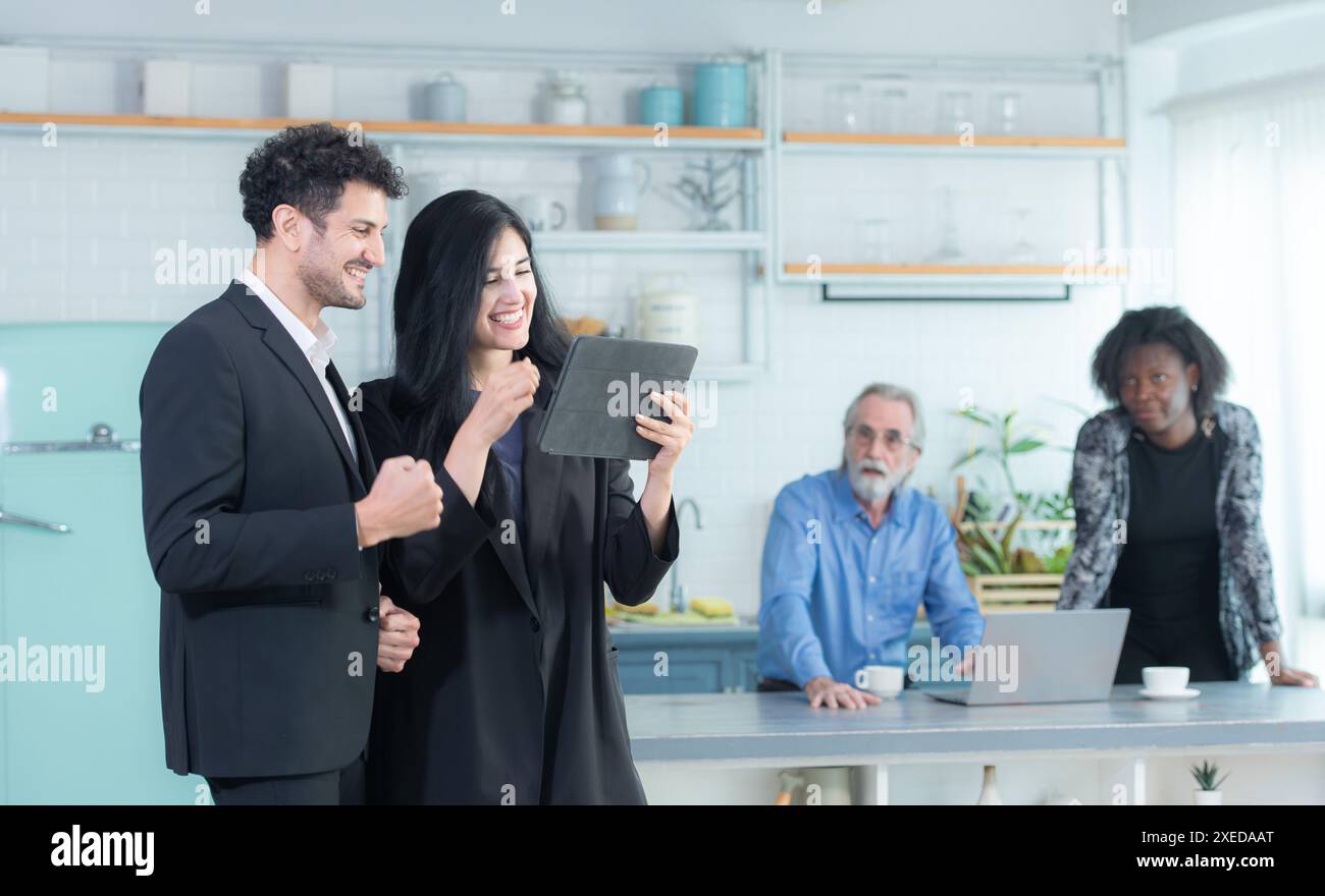 Portrait of group of small business owners, using their home as a ...