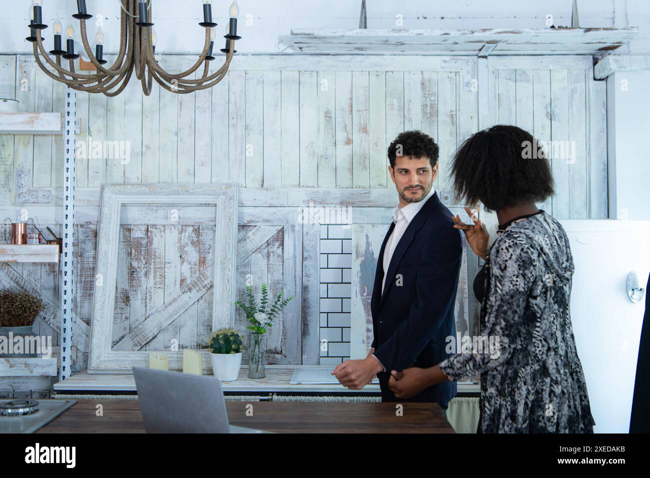 In a modern clothes fashion room, a clothing designer or tailor allows ...