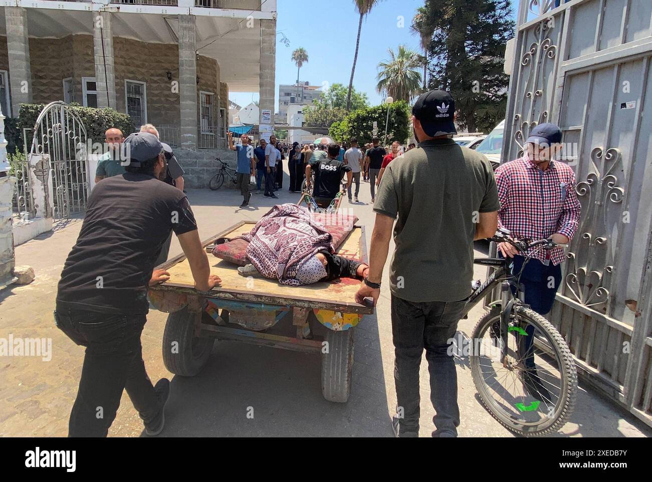 Wounded and bodies of the Palestinian victims of the attack are brought ...