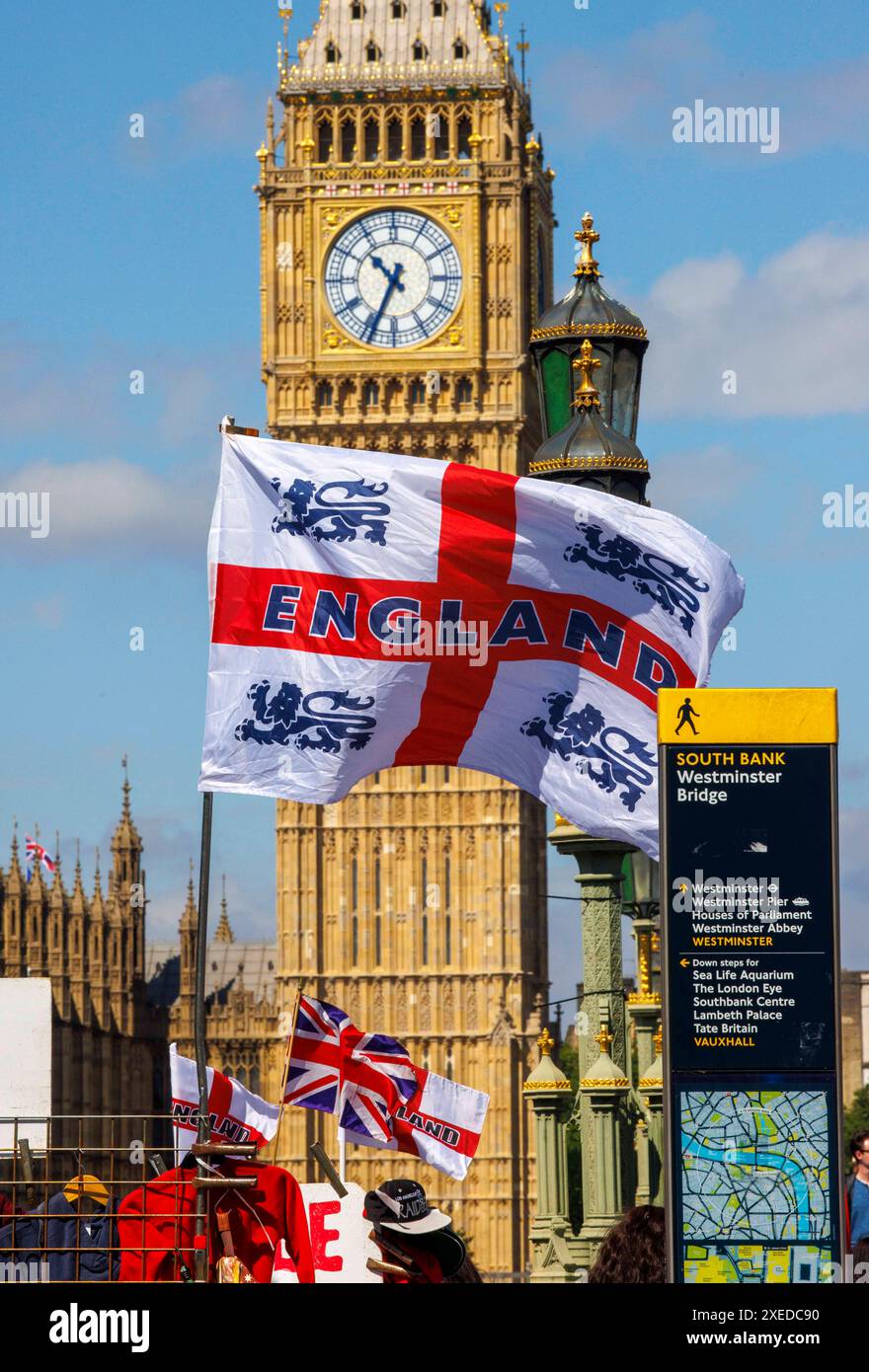 An England flag flies in the wind with Big Ben which was renamed the ...