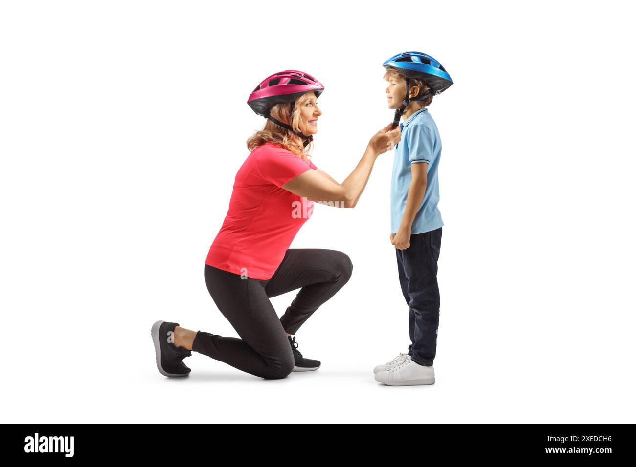 Mother and son getting ready for a bicycle ride isolated on white ...