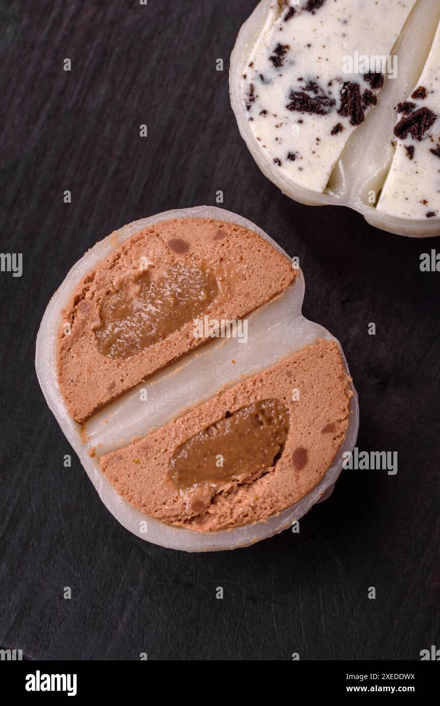 Delicious sweet mochi dessert with toppings on a dark concrete ...