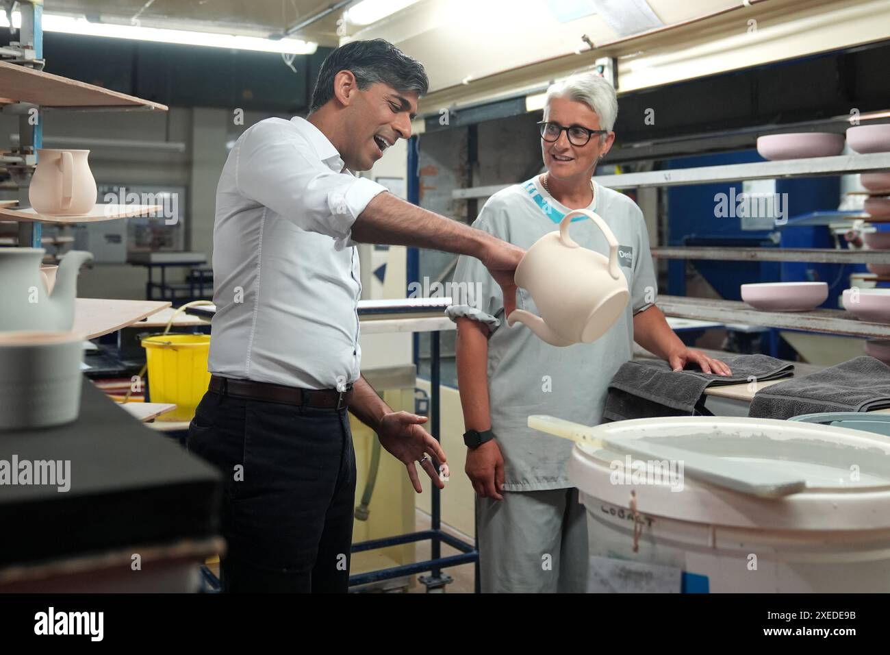 Prime Minister Rishi Sunk dipping pots with staff member Georgia ...