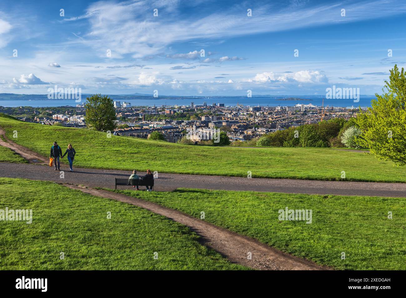 Park lawn with path and road on the Calton Hill in city of Edinburgh in ...